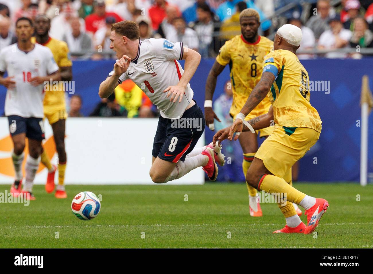 England midfielder Elliot Anderson is tripped up in front of Ghana ...