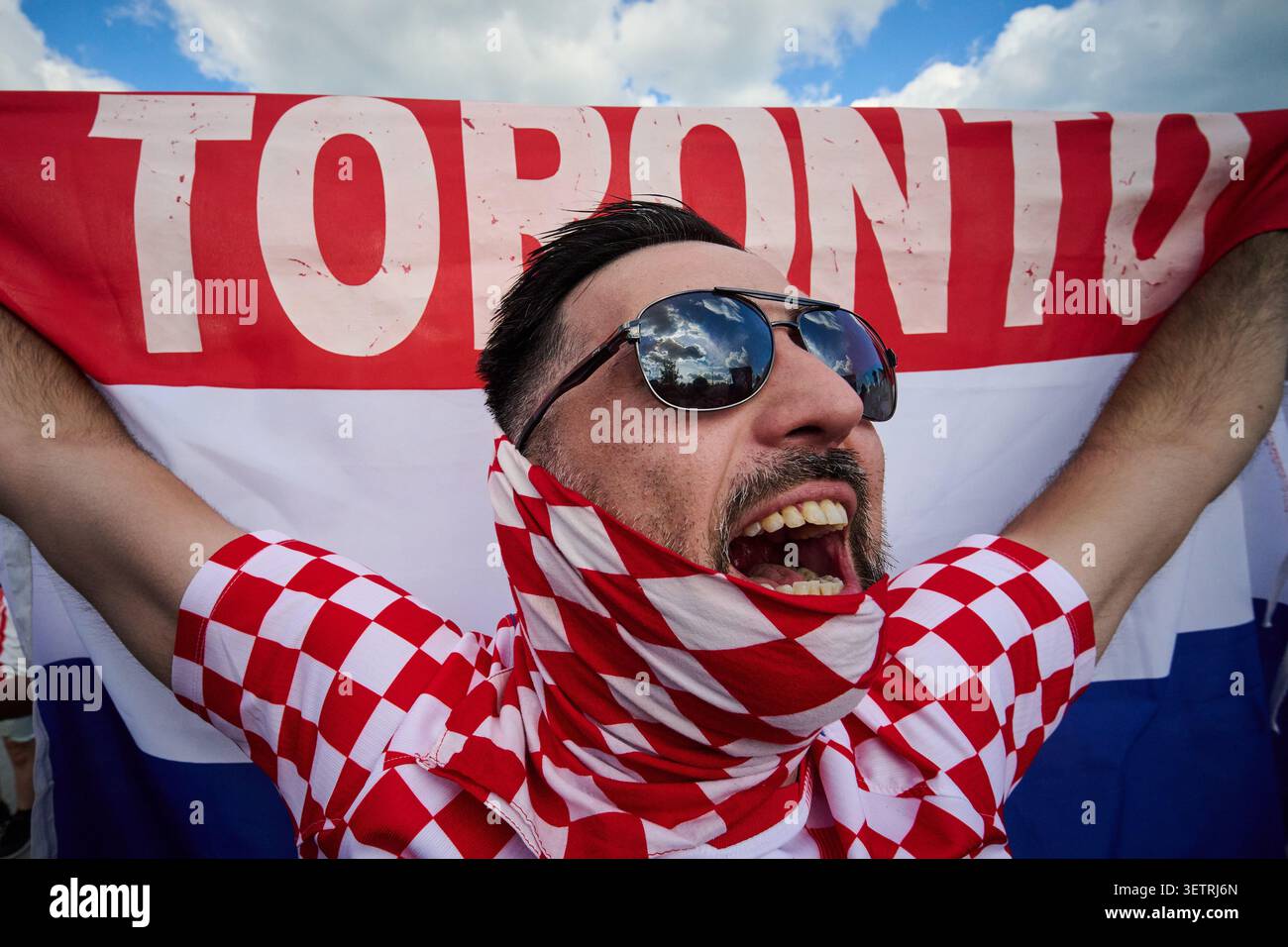 A Croatia fan cheers for his team outside Toronto Stadium before a ...