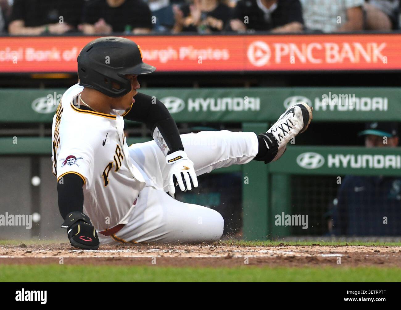 The Pittsburgh Pirates' Endy Rodriguez slides home for a run against ...