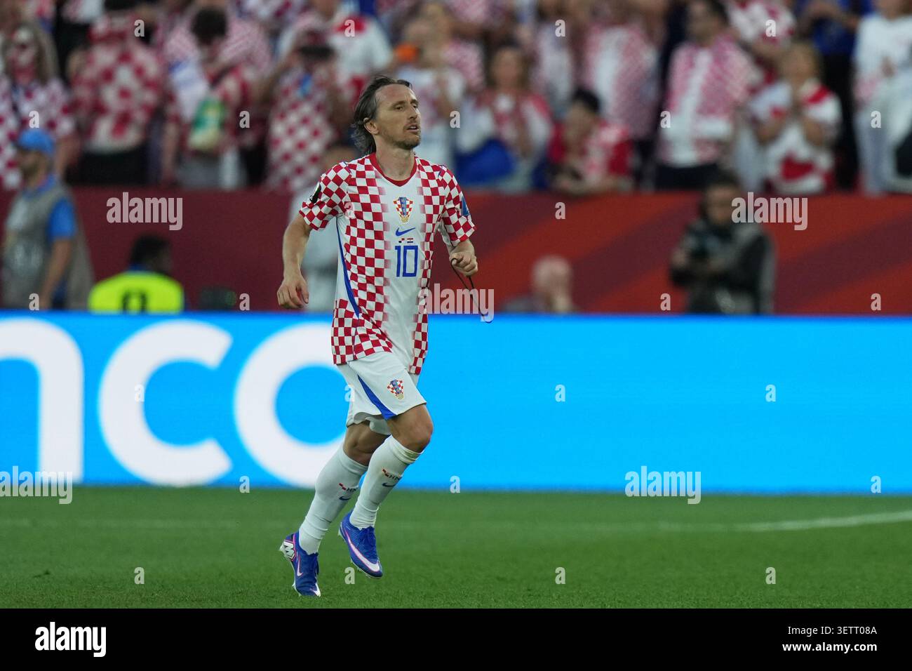 Croatia's Luka Modric, left, leaves the pitch after being substituted ...