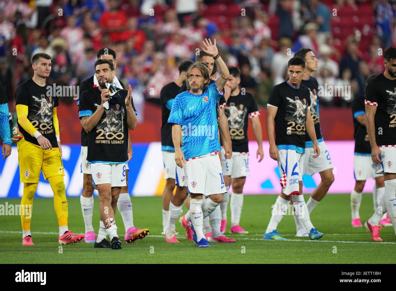 Croatia's Luka Modric, center, and teammates walk on the pitch after ...