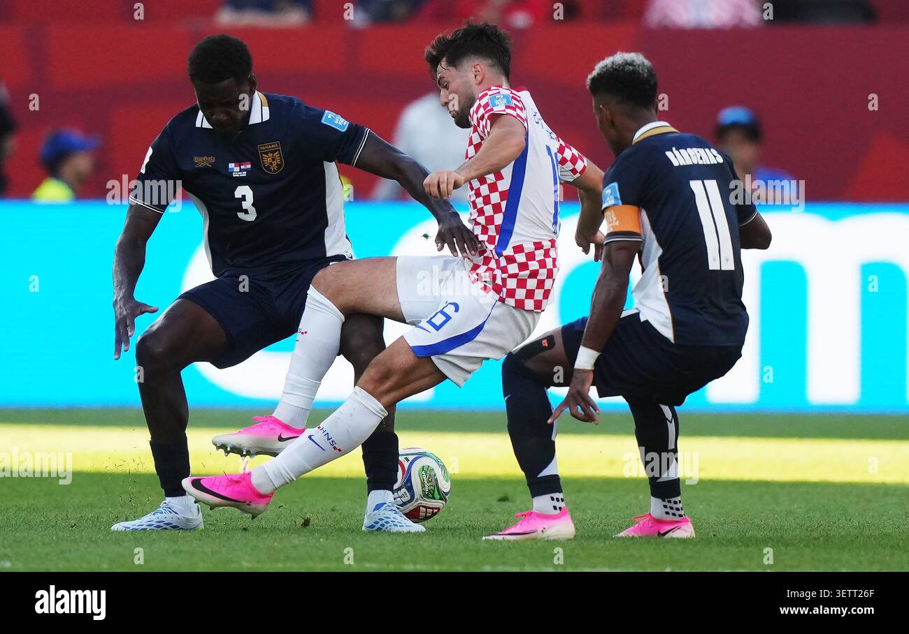 Croatia's Martin Baturina (centre) is tripped up by Panama's Jose ...