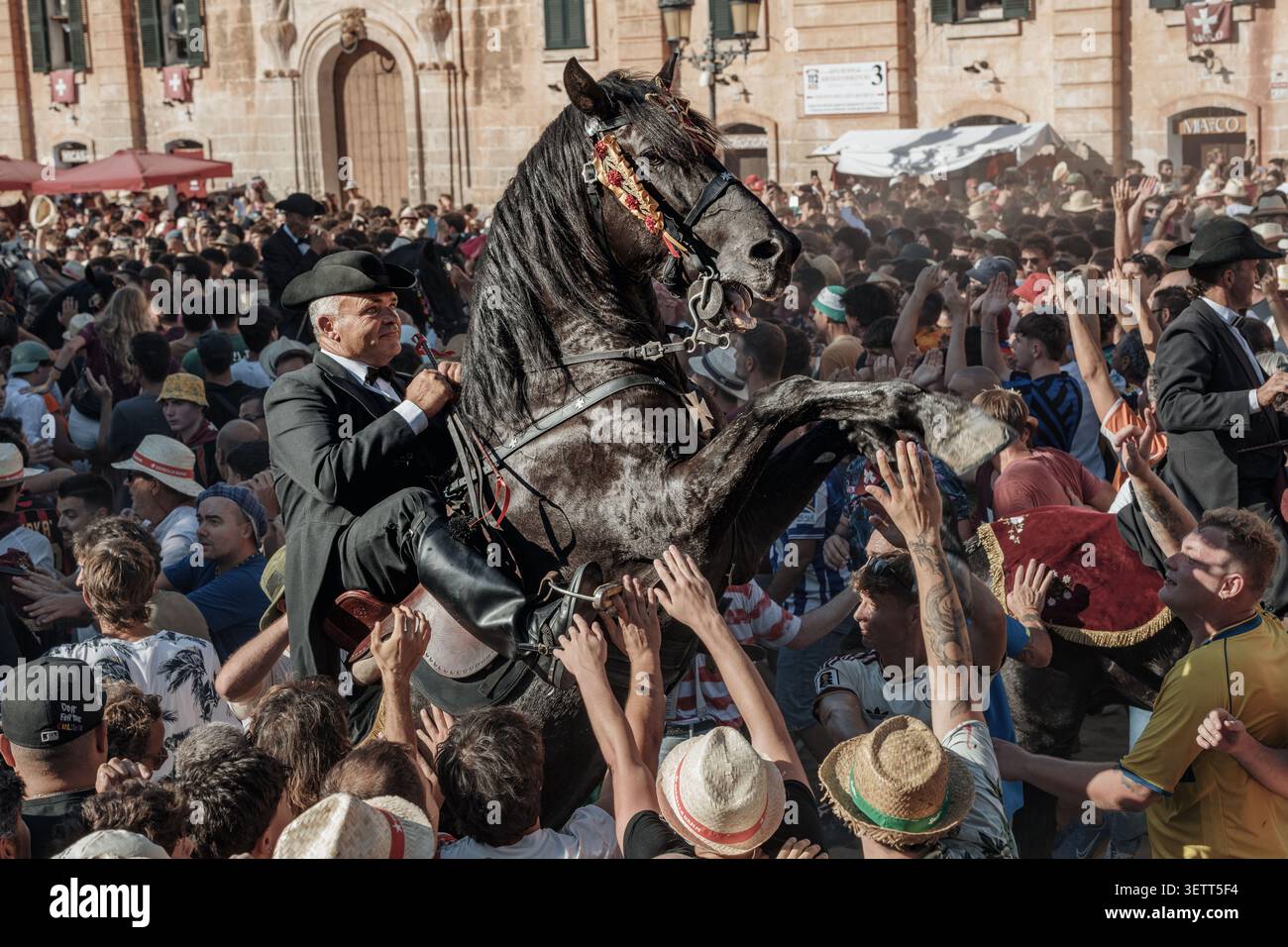 Ciutadella, Spain. 23 June, 2026: A 'caixer' (horse rider) rears up on ...