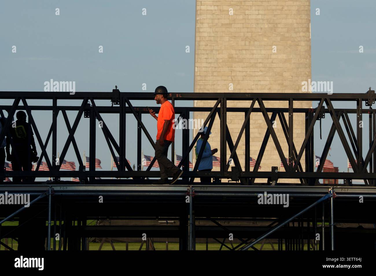 Workers build the stage for the July 4th Salute to America Celebration ...