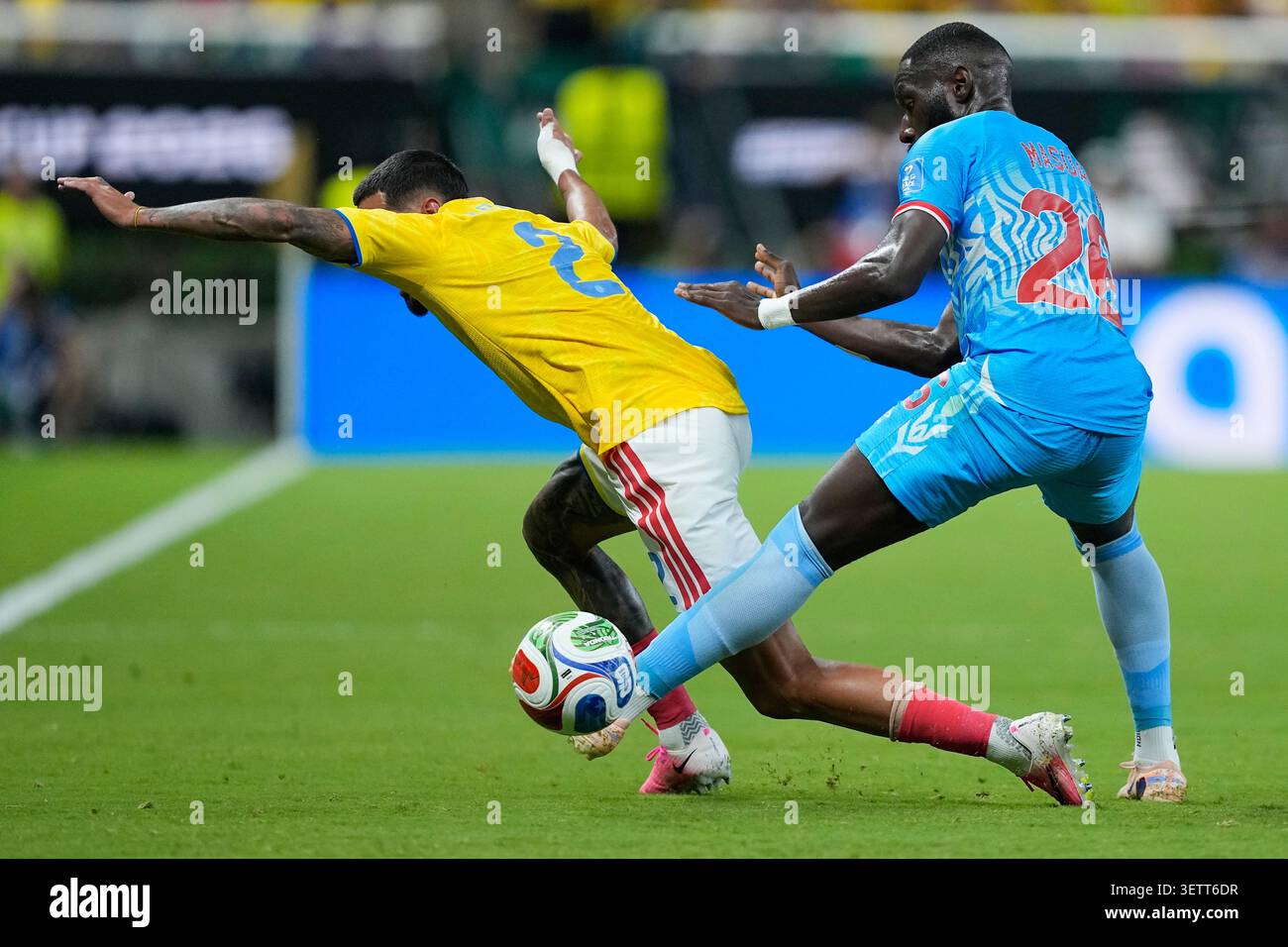 Congo's Arthur Masuaku (26) and Colombia's Daniel Munoz (2) battle for ...