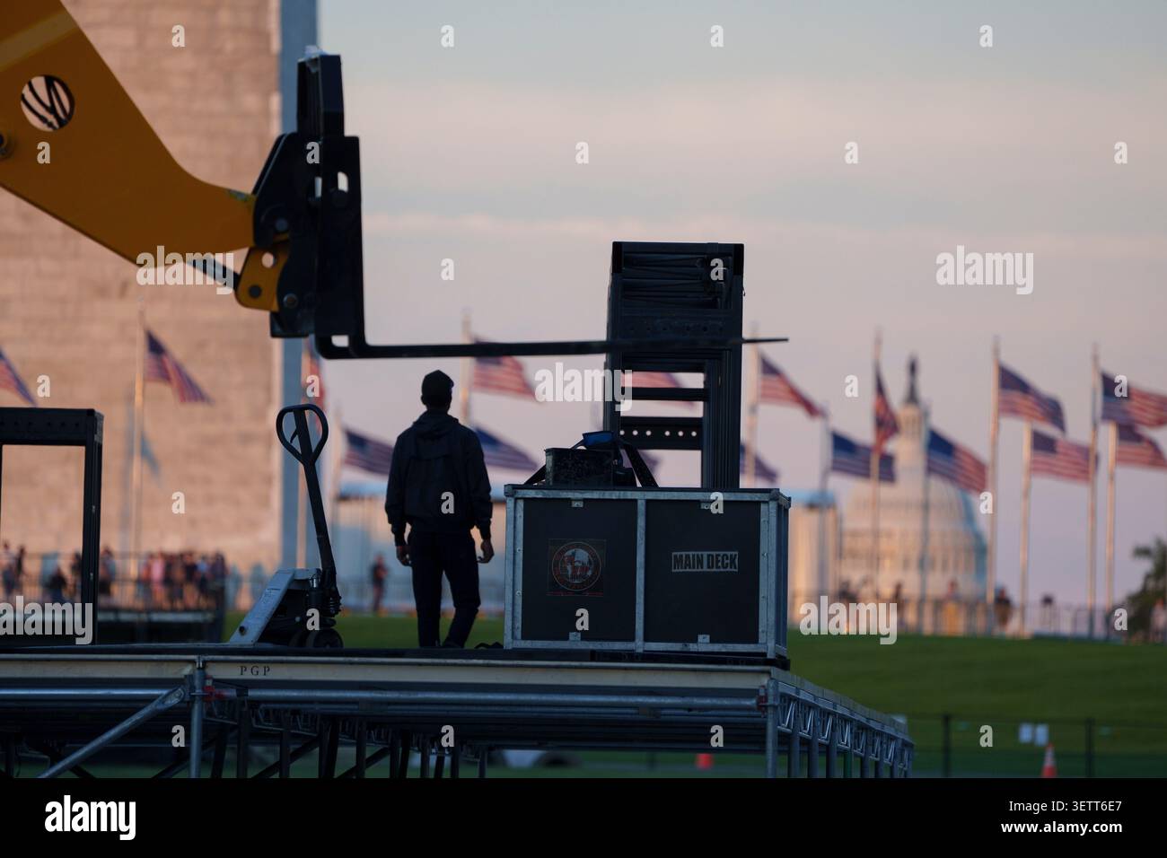 Workers build the stage for the July 4th Salute to America Celebration ...