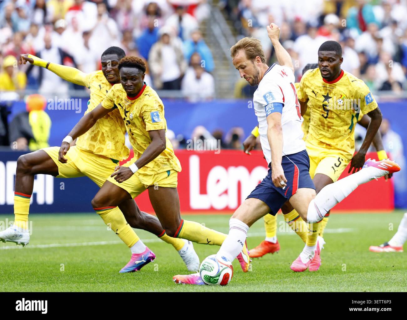 England's Harry Kane (front, R) attempts to shoot in the first half of ...