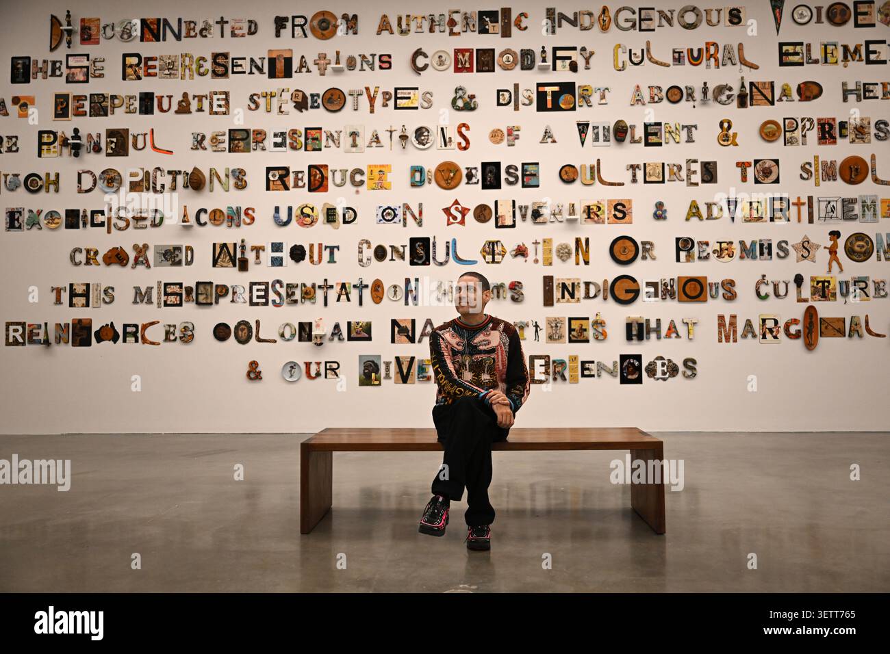 Artist Tony Albert poses for a photo in front of his work ‘Disconnected ...