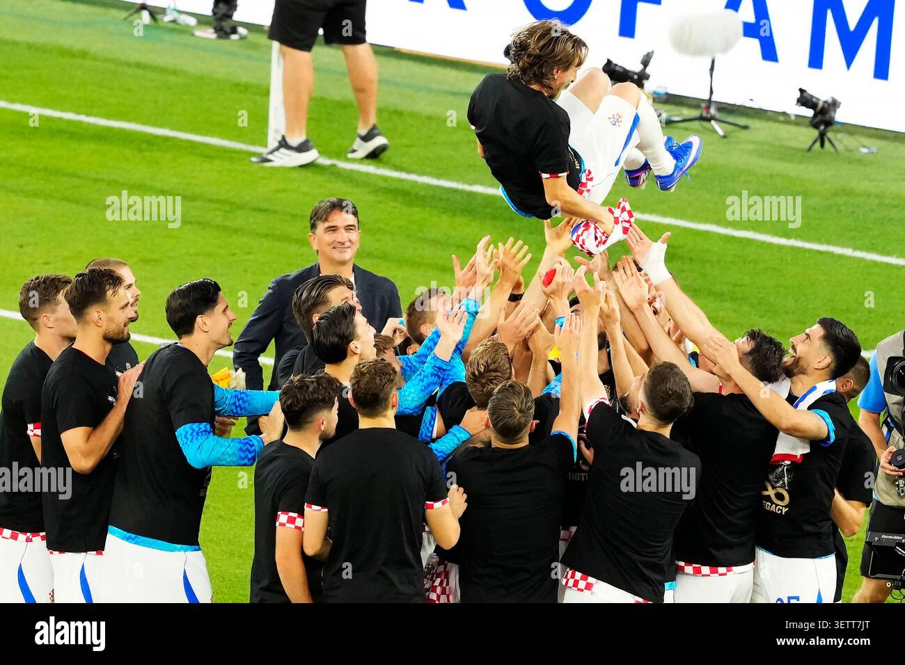 Croatia players throw Croatia's Luka Modric in the air to celebrate his ...