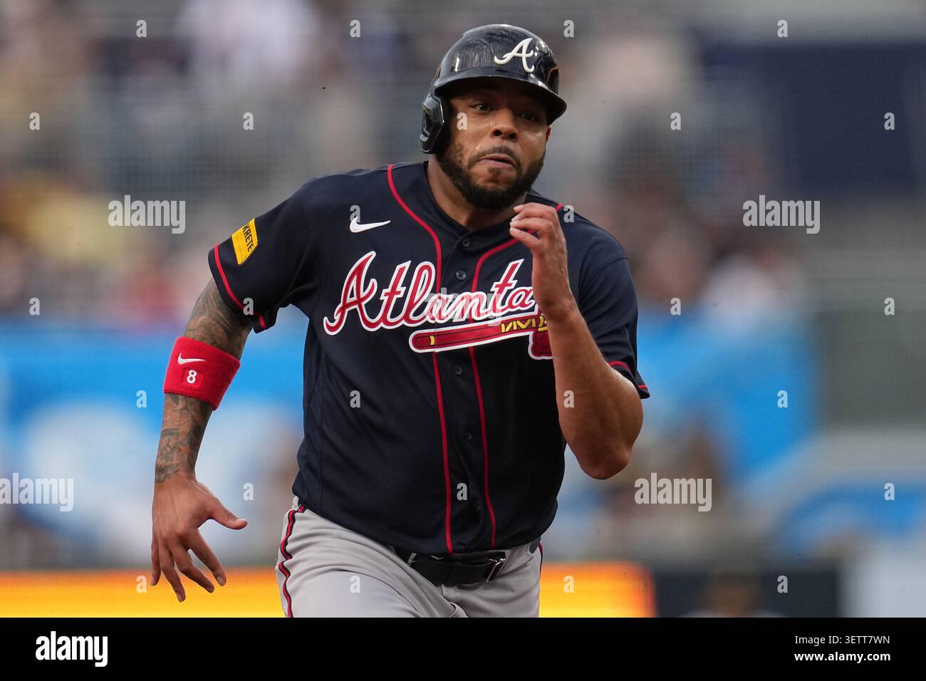 Atlanta Braves' Dominic Smith runs towards third base, advancing from ...