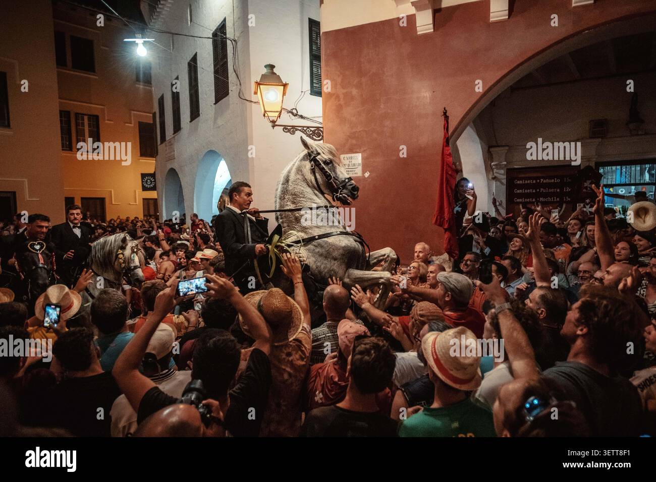 Ciutadella, Spain. 23 June, 2026: A 'caixer' (horse rider) enters up on ...