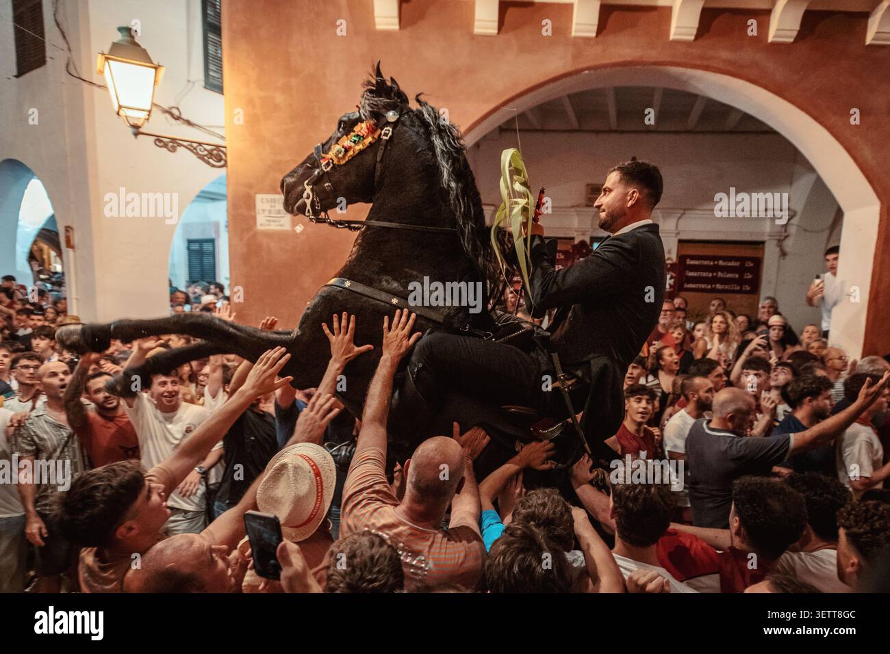Ciutadella, Spain. 23 June, 2026: A 'caixer' (horse rider) enters up on ...