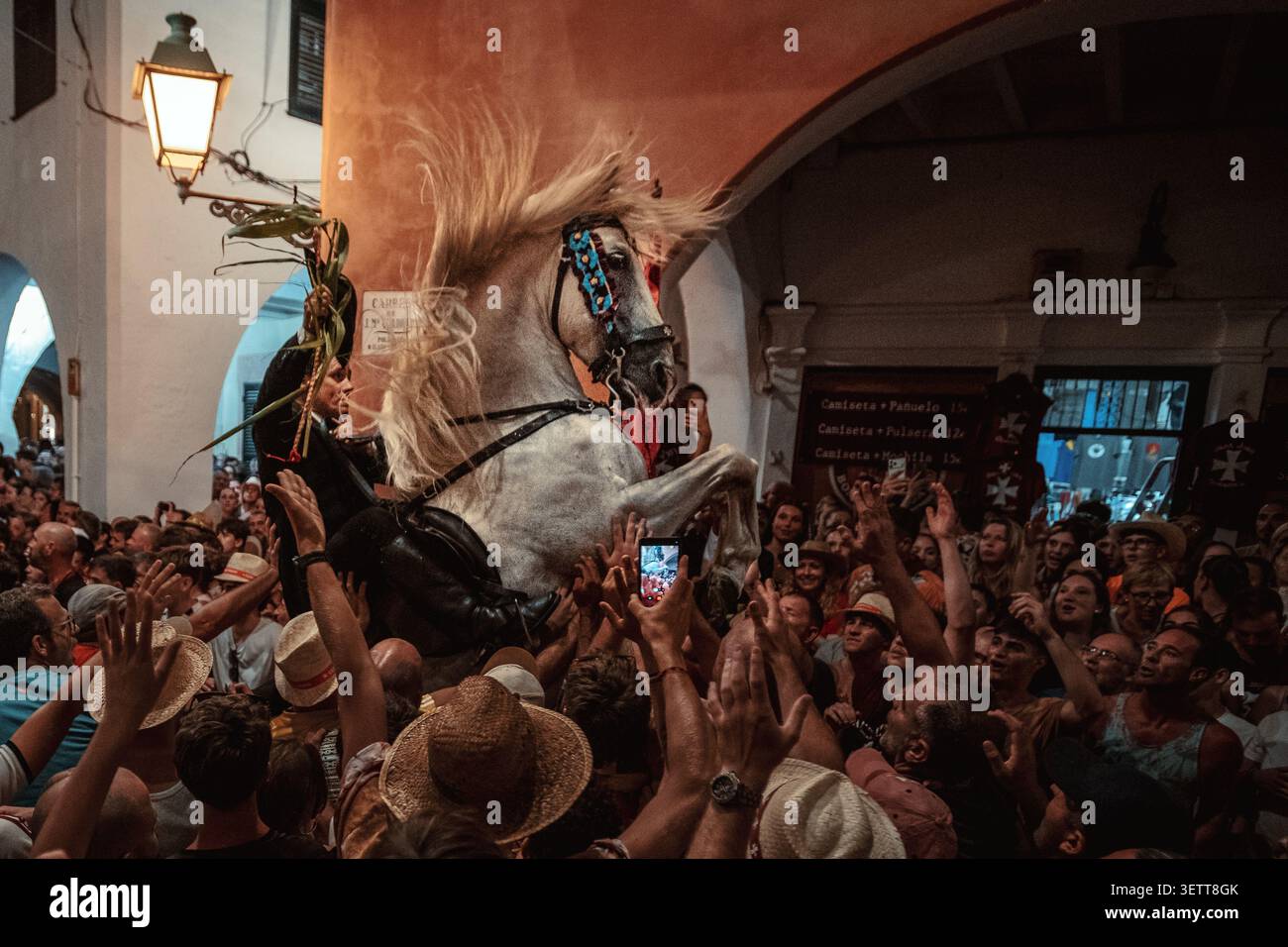 Ciutadella, Spain. 23 June, 2026: A 'caixer' (horse rider) enters up on ...
