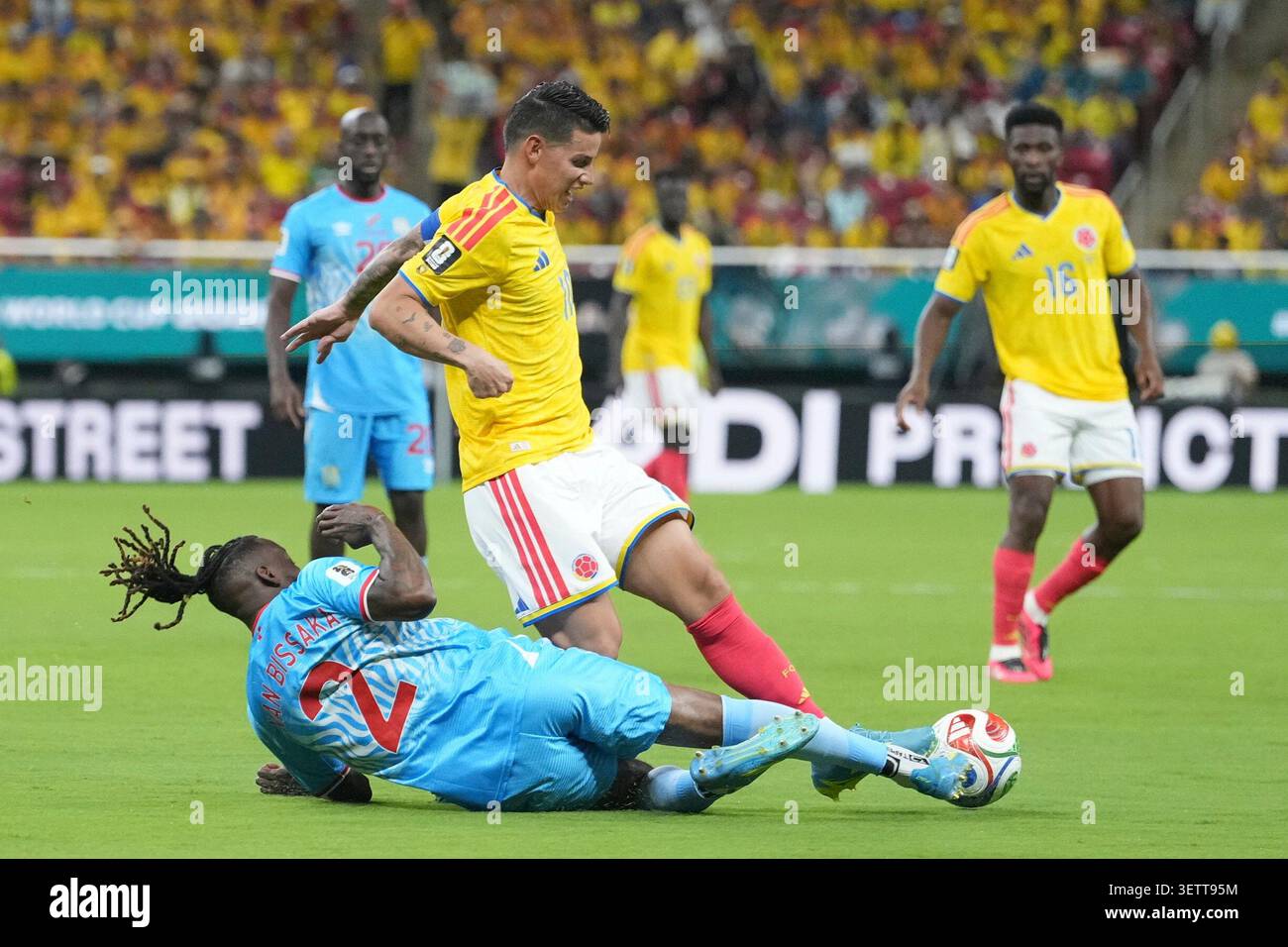 Colombia's James Rodriguez (10) battles for the ball with Congo's Aaron ...