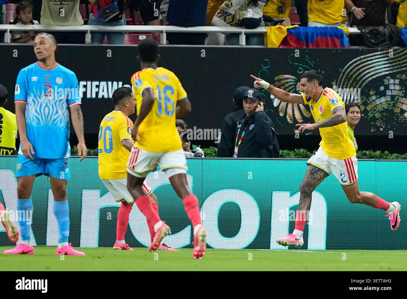 Colombia's Daniel Munoz, right, celebrates after scoring his team's ...