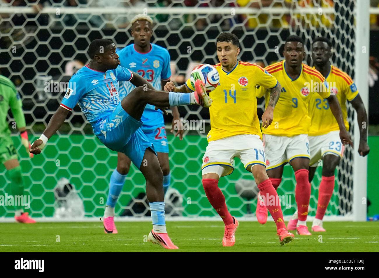 Congo's Noah Sadiki, left, controls the ball past Colombia's Gustavo ...