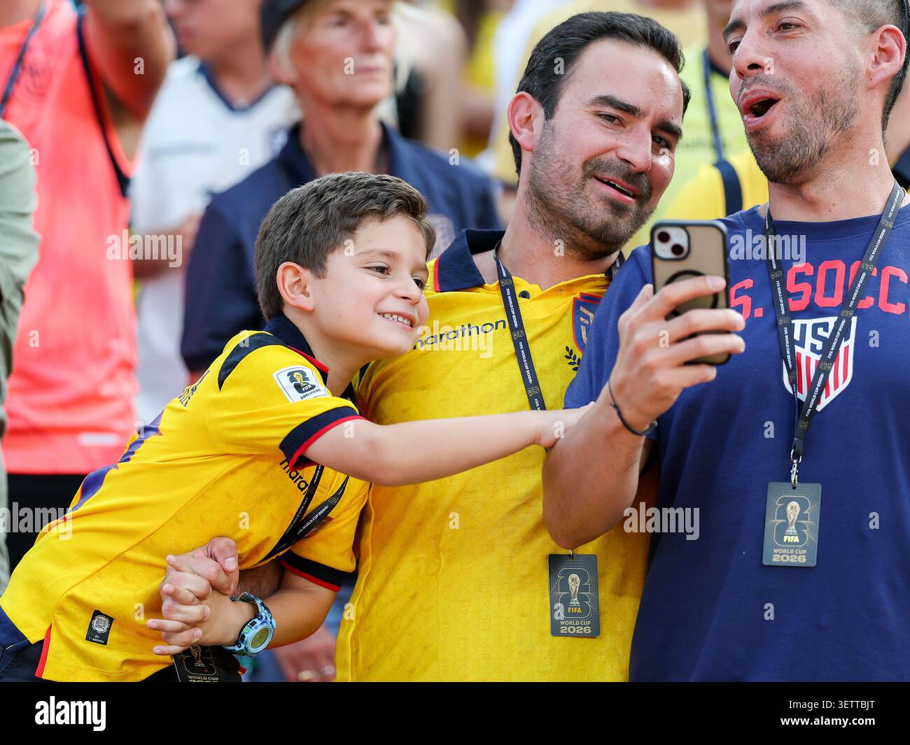 June 20, 2026: A father and son check their friends phone prior to the ...