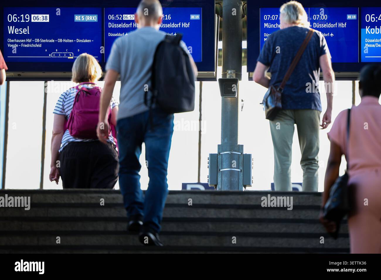 24 June 2026, North Rhine-Westphalia, Duisburg: Passengers are walking ...