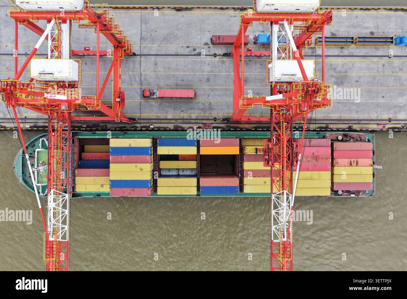 Containers are loaded and unloaded at Yangzhou Port in east China's ...