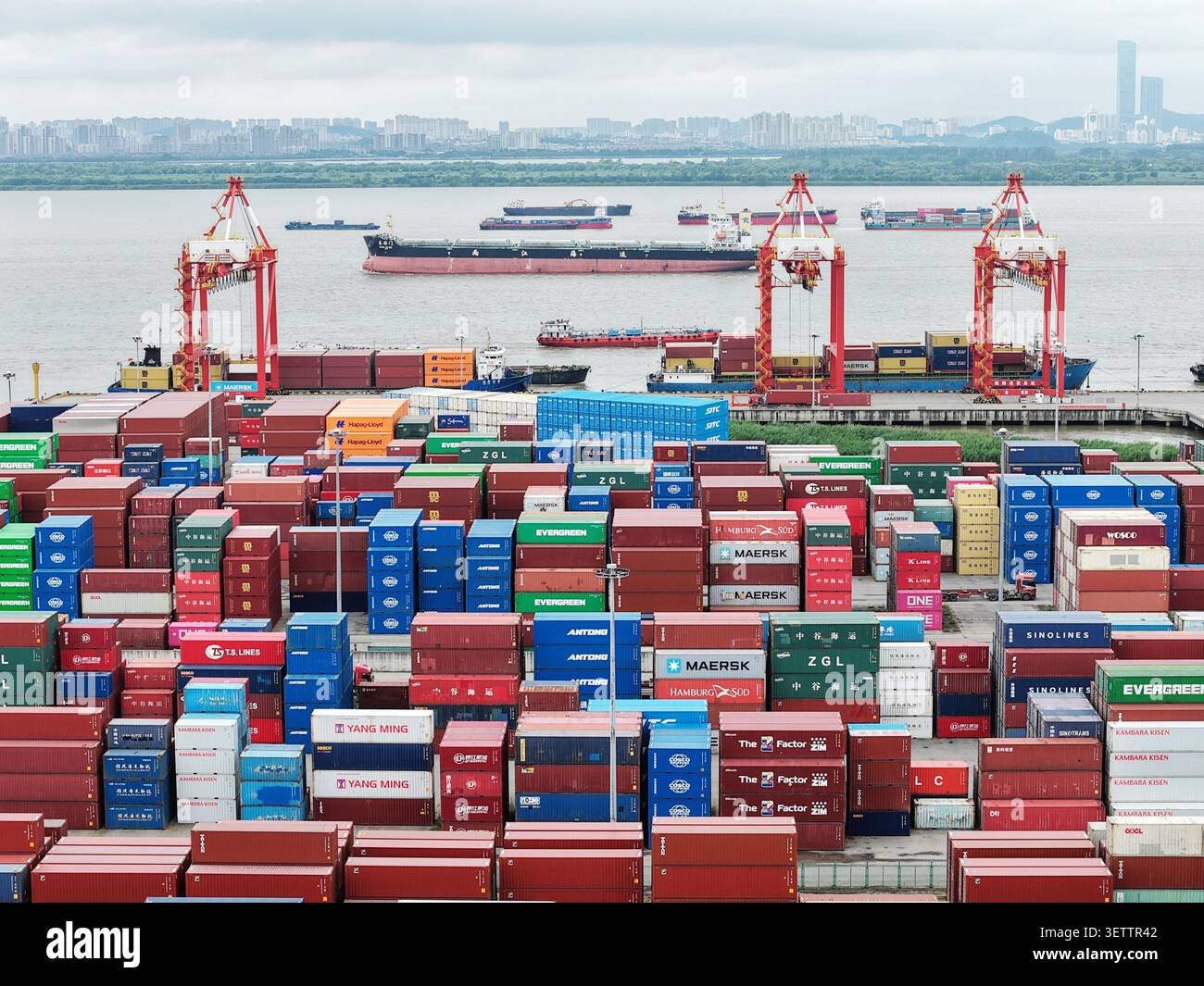 Containers are loaded and unloaded at Yangzhou Port in east China's ...