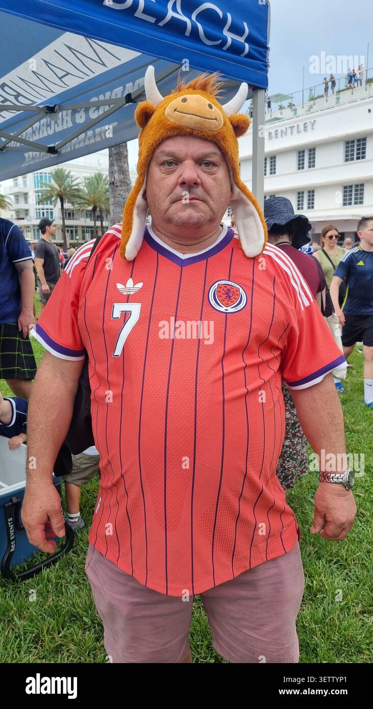 Scotland fan John O'Neill takes part in the Tartan Army march in Miami ...