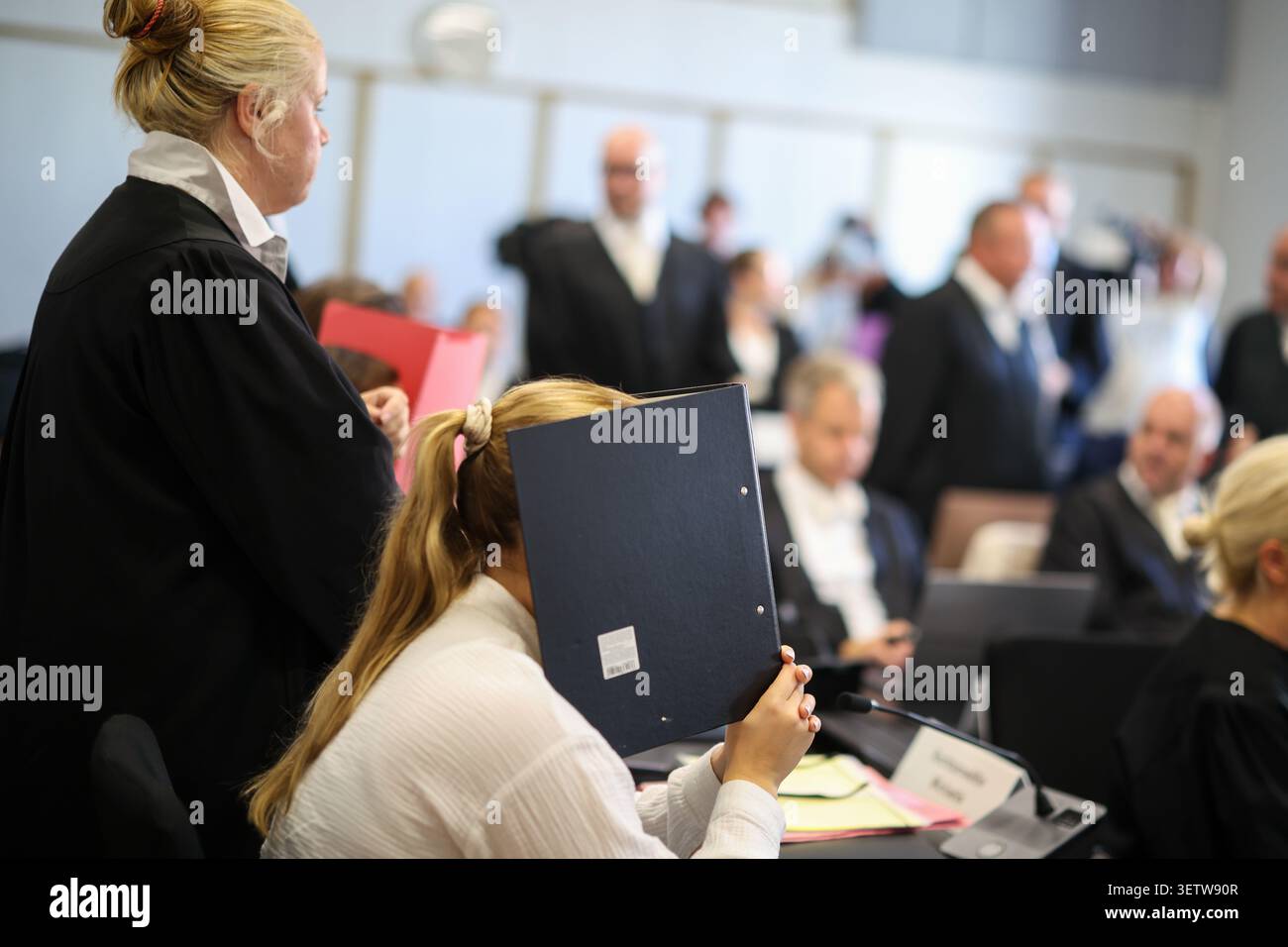 24 June 2026, North Rhine-Westphalia, Duisburg: A police officer on ...