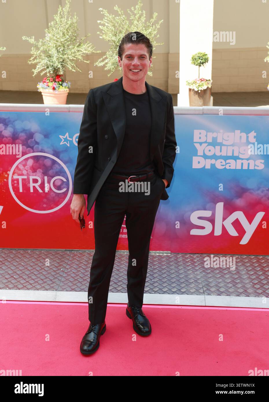 Lewis Cope seen attending the TRIC Awards 2026 at Grosvenor House in ...