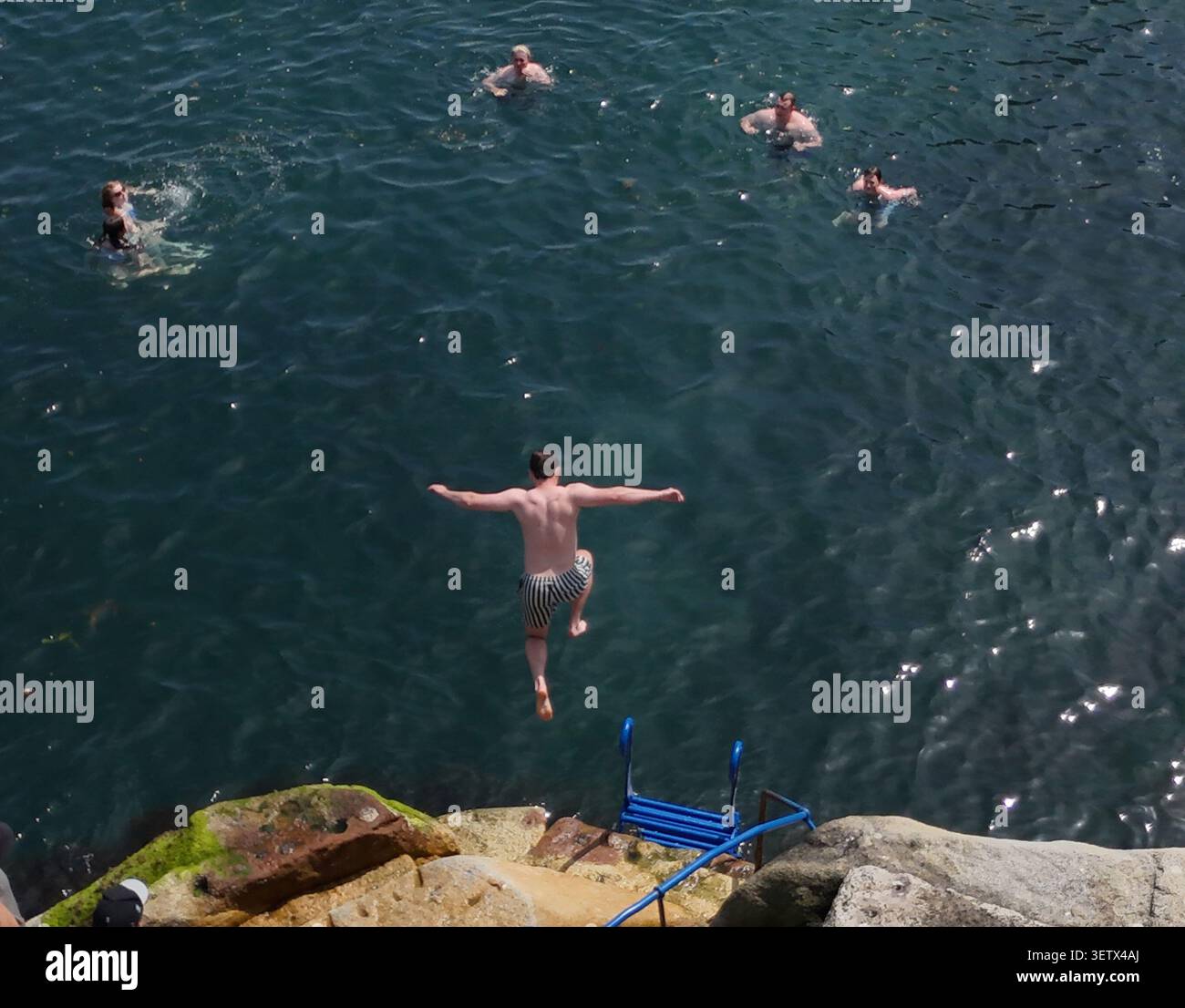 People cooling off at the Forty Foot bathing place at Sandycove in ...