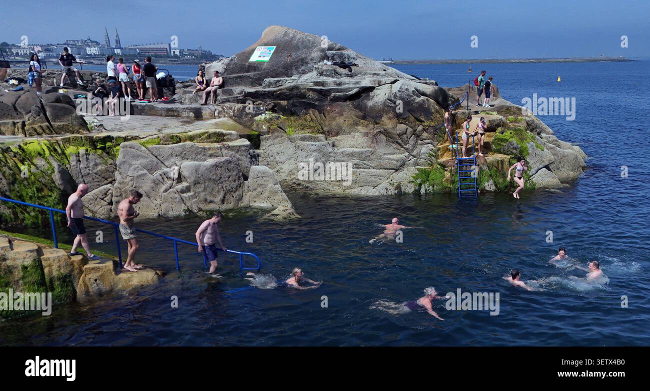 People cooling off at the Forty Foot bathing place at Sandycove in ...