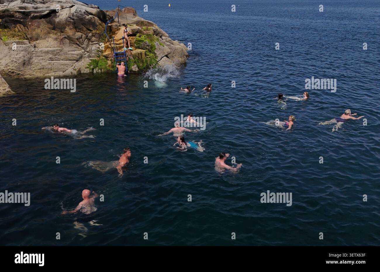 People cooling off at the Forty Foot bathing place at Sandycove in ...