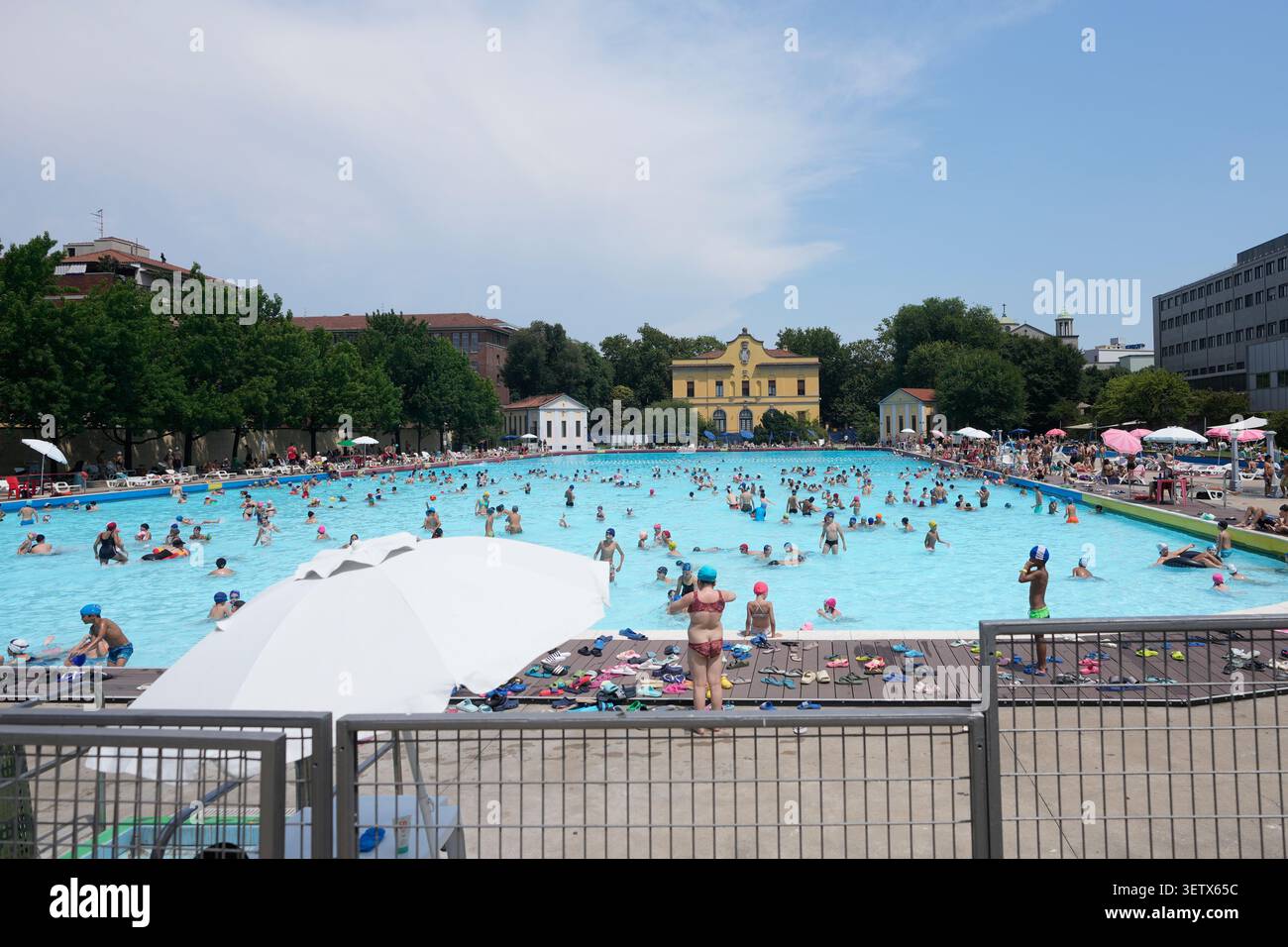 People cool off at the Piscina Romano as a heat wave is predicted ...