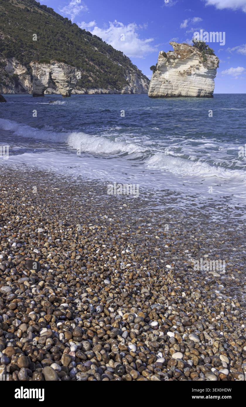 Sea stack called Forbici (scissor) washed by the emerald green sea and ...