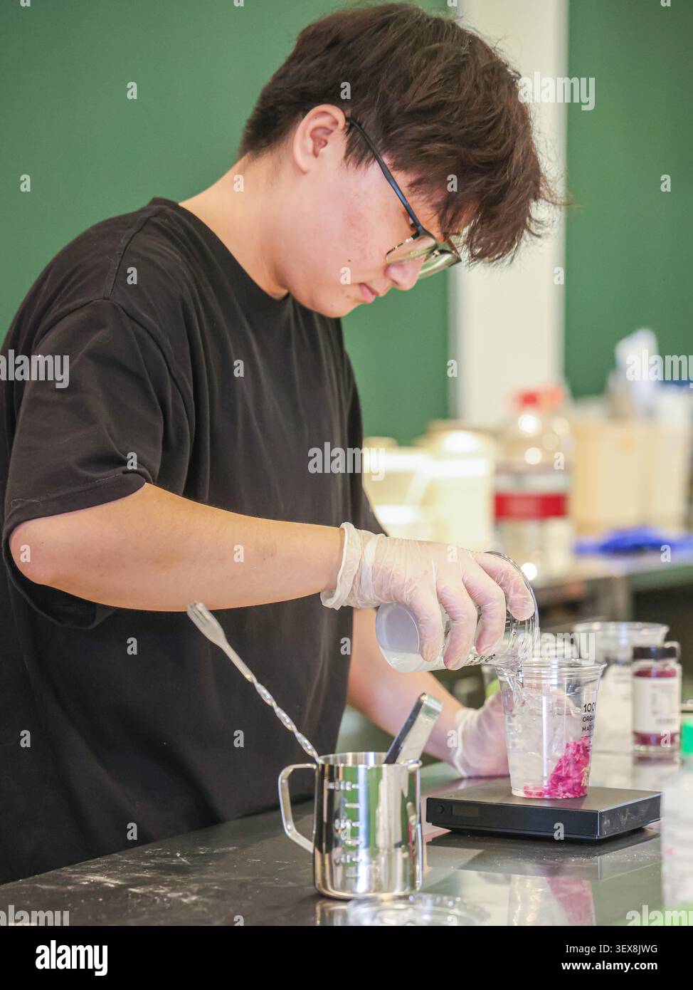 A staff member of The Matcha Tokyo makes a drink at the first phase of ...