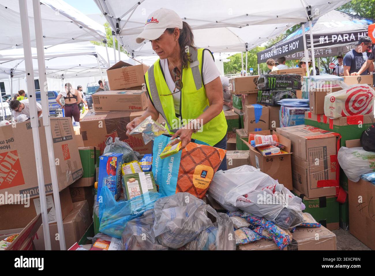 Jessica Welle sorts donated items at the Global Empowerment Mission ...