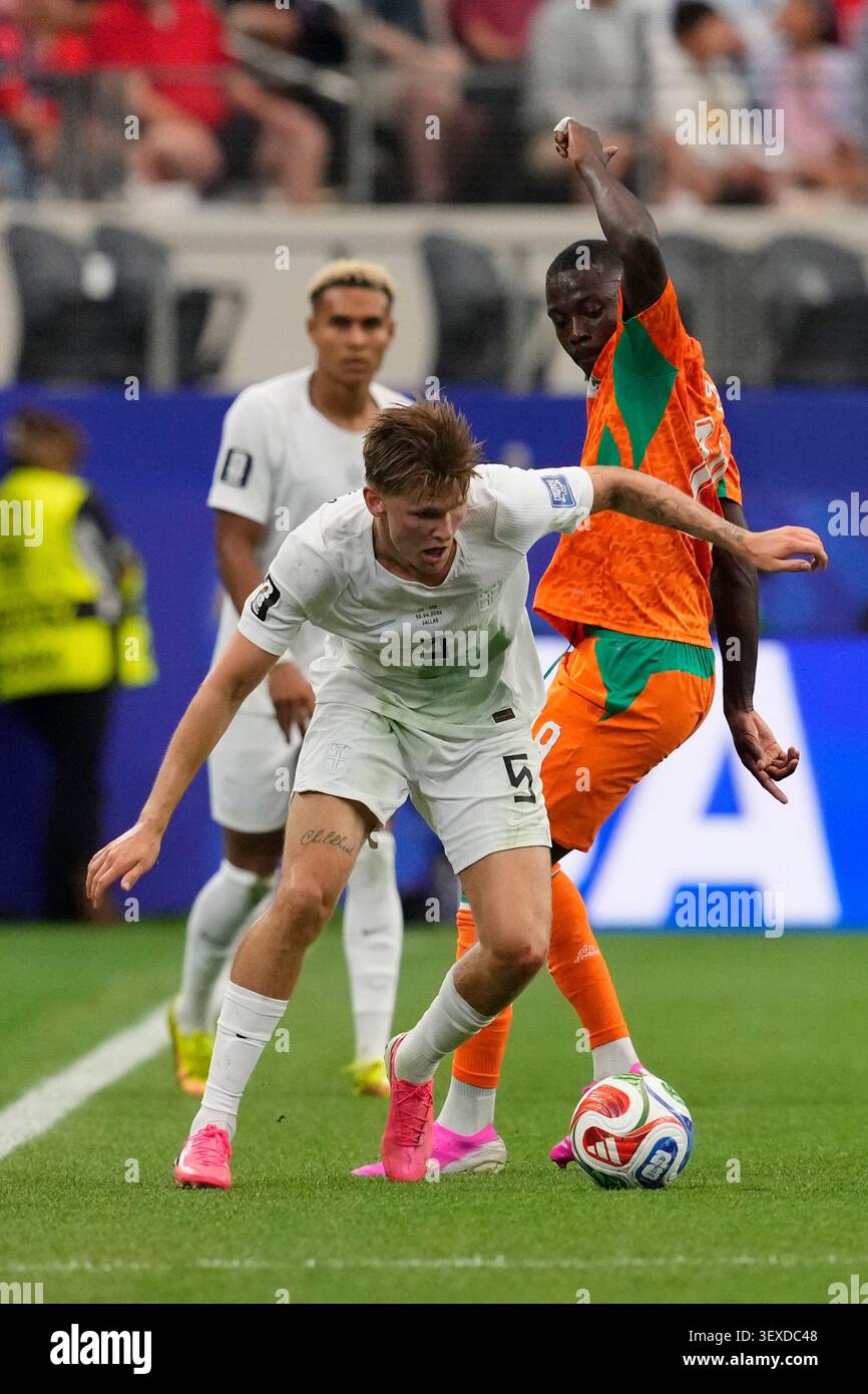 Ivory Coast's Nicolas Pepe (19), background, tries to stop Norway's ...