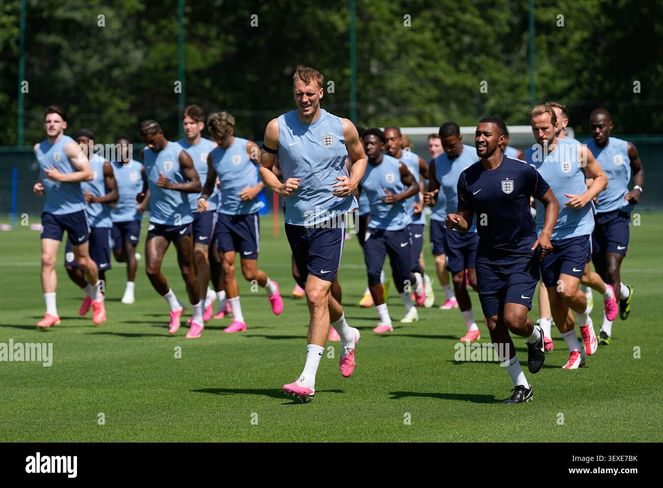 England's Dan Burn, front center, runs with teammates during training ...