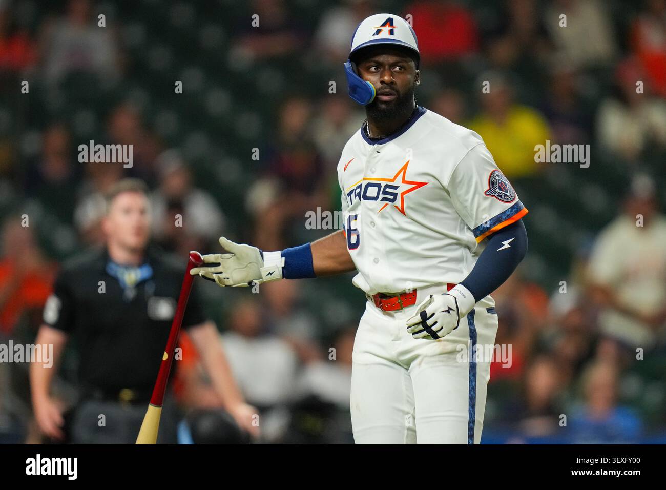 Houston Astros' Taylor Trammell flips the bat as he watches his home ...