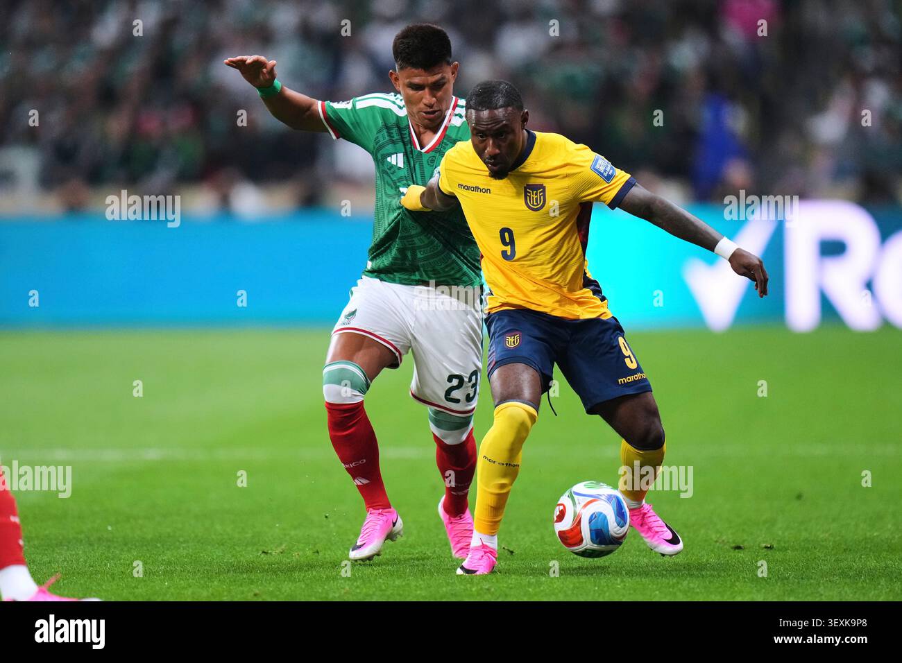 Ecuador's John Yeboah (9), left, challenges for the ball with Mexico's ...