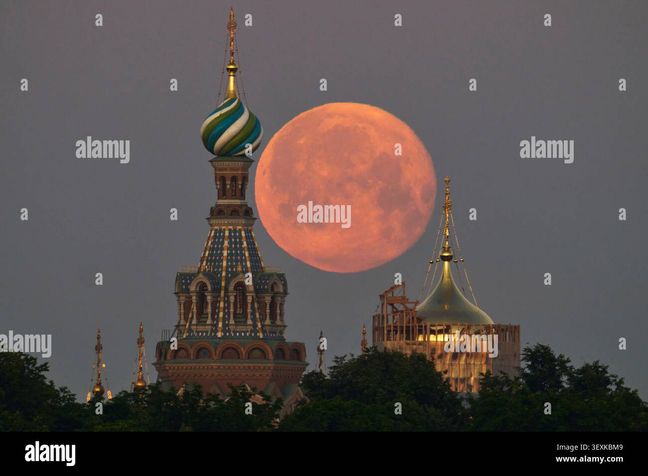 The full moon sets behind the Saviour of Spilled Blood Cathedral in St ...