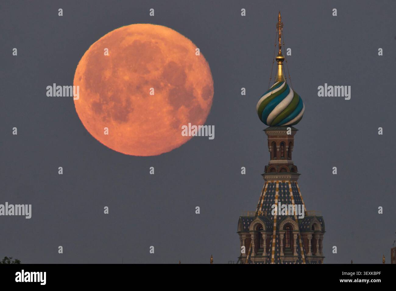 The full moon sets behind the Saviour of Spilled Blood Cathedral in St ...