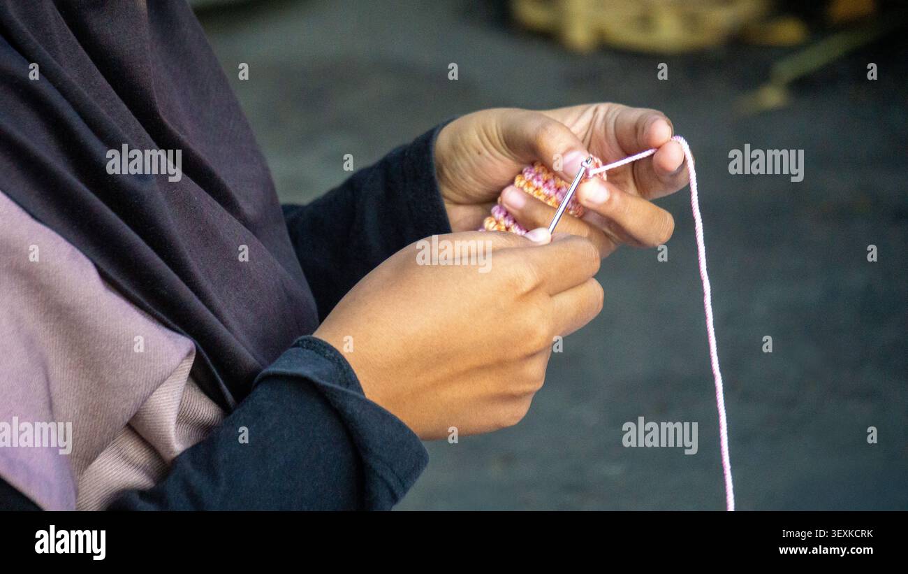 Creating items (lipstick holder) using the craft of knitting. An ...