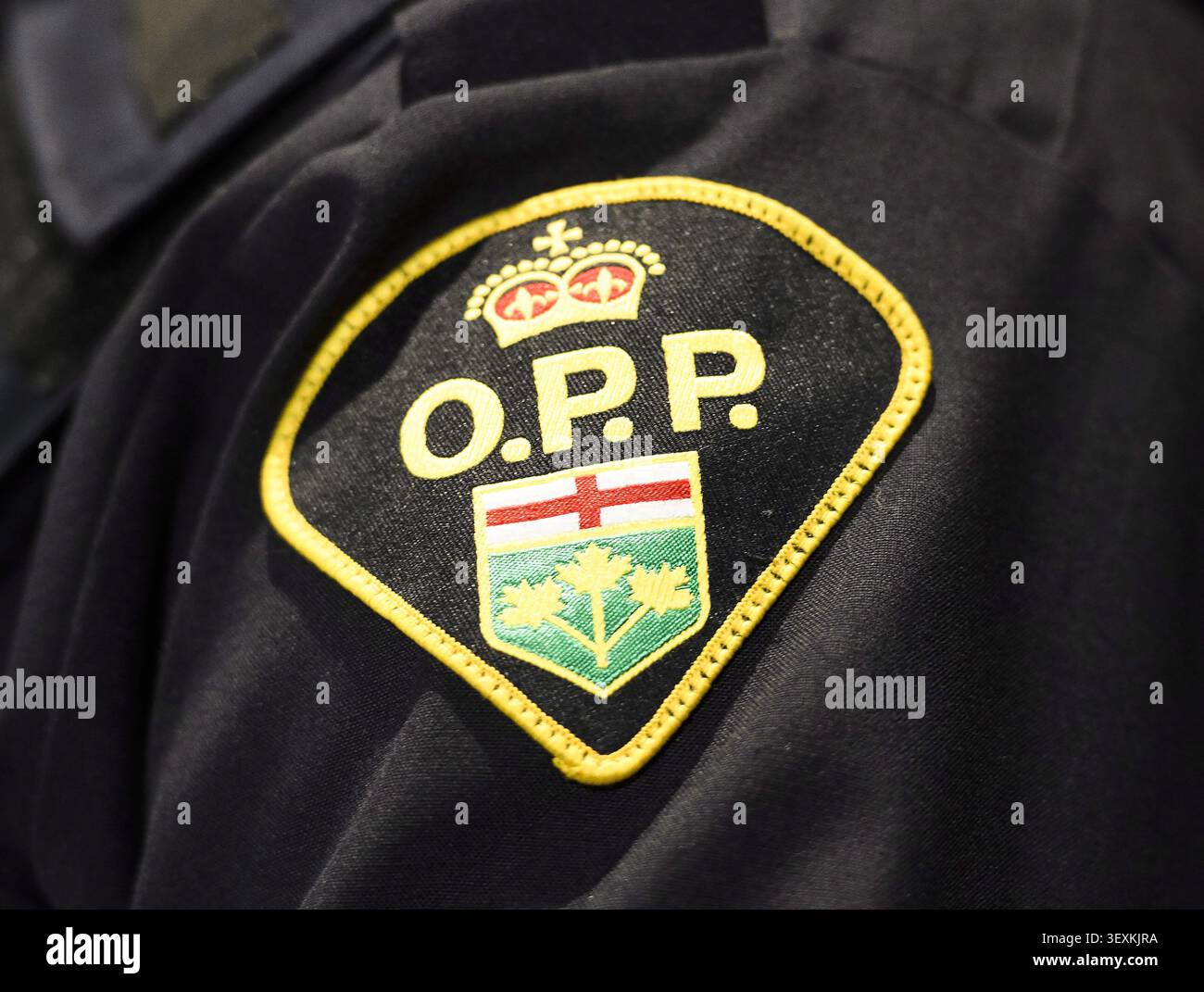 An Ontario Provincial Police logo is shown during a press conference in ...