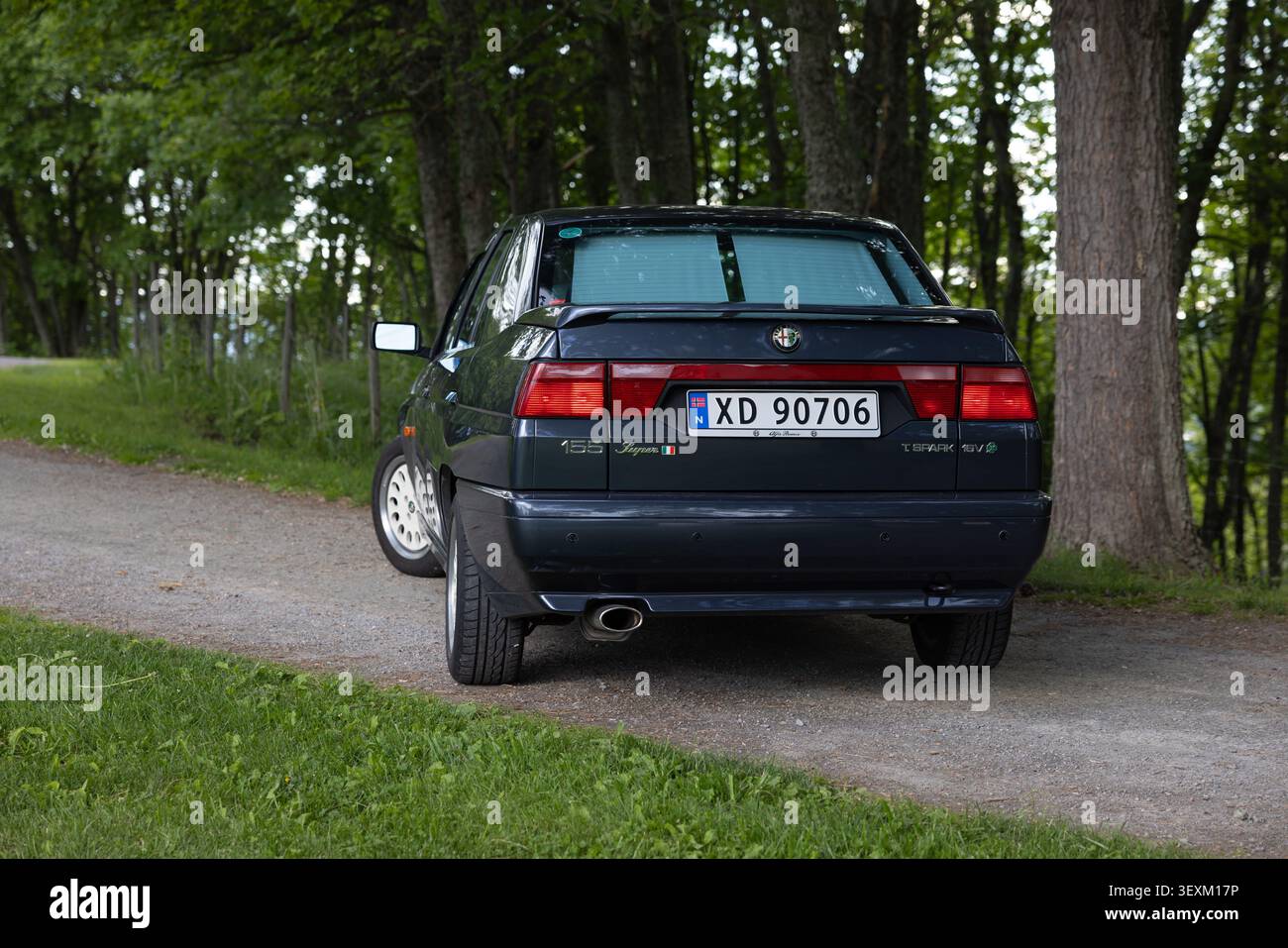 Steinkjer, Norway - June 15th 2024 - Dark Alfa Romeo 155 parked beside ...