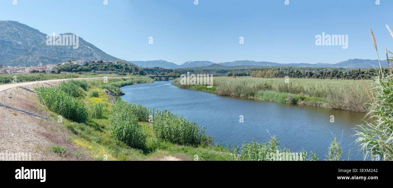 large size panoramic landscape with embankment road and lush vegetation ...
