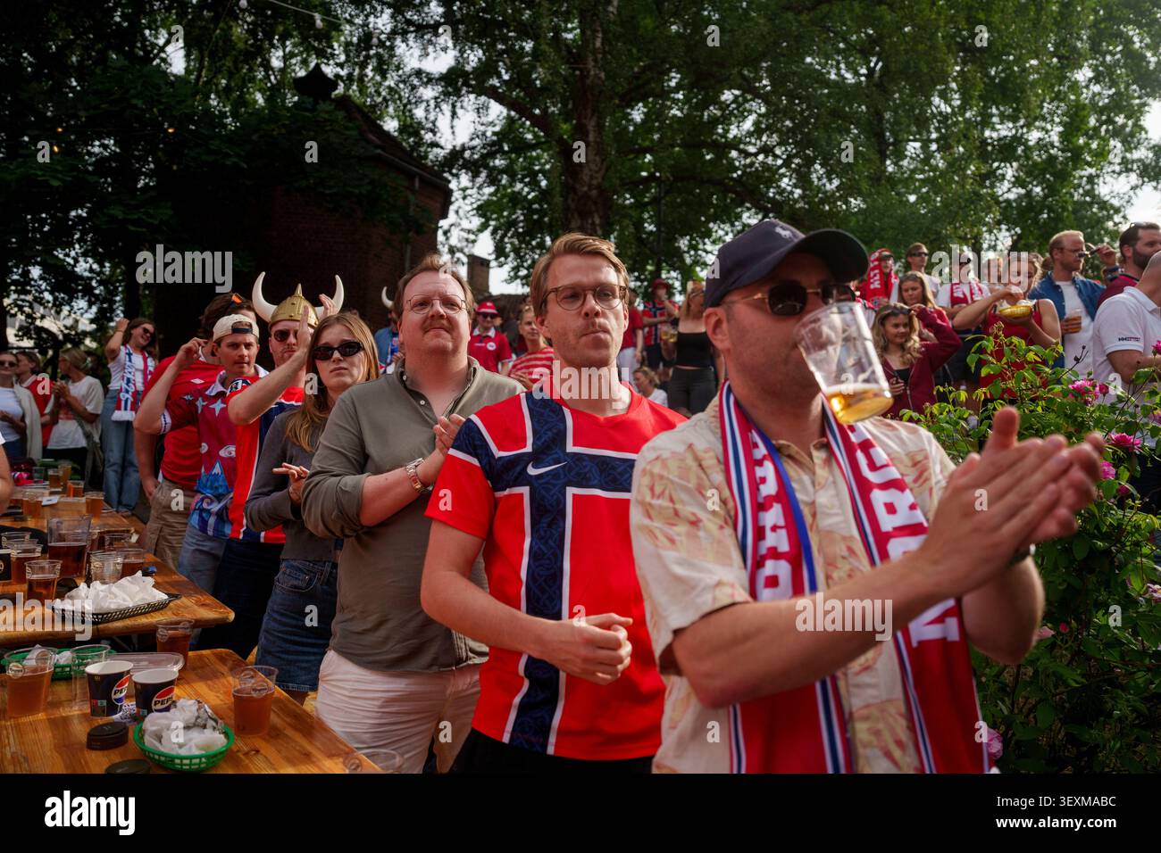 Oslo 20260630. Many people watch the World Cup match between Ivory ...