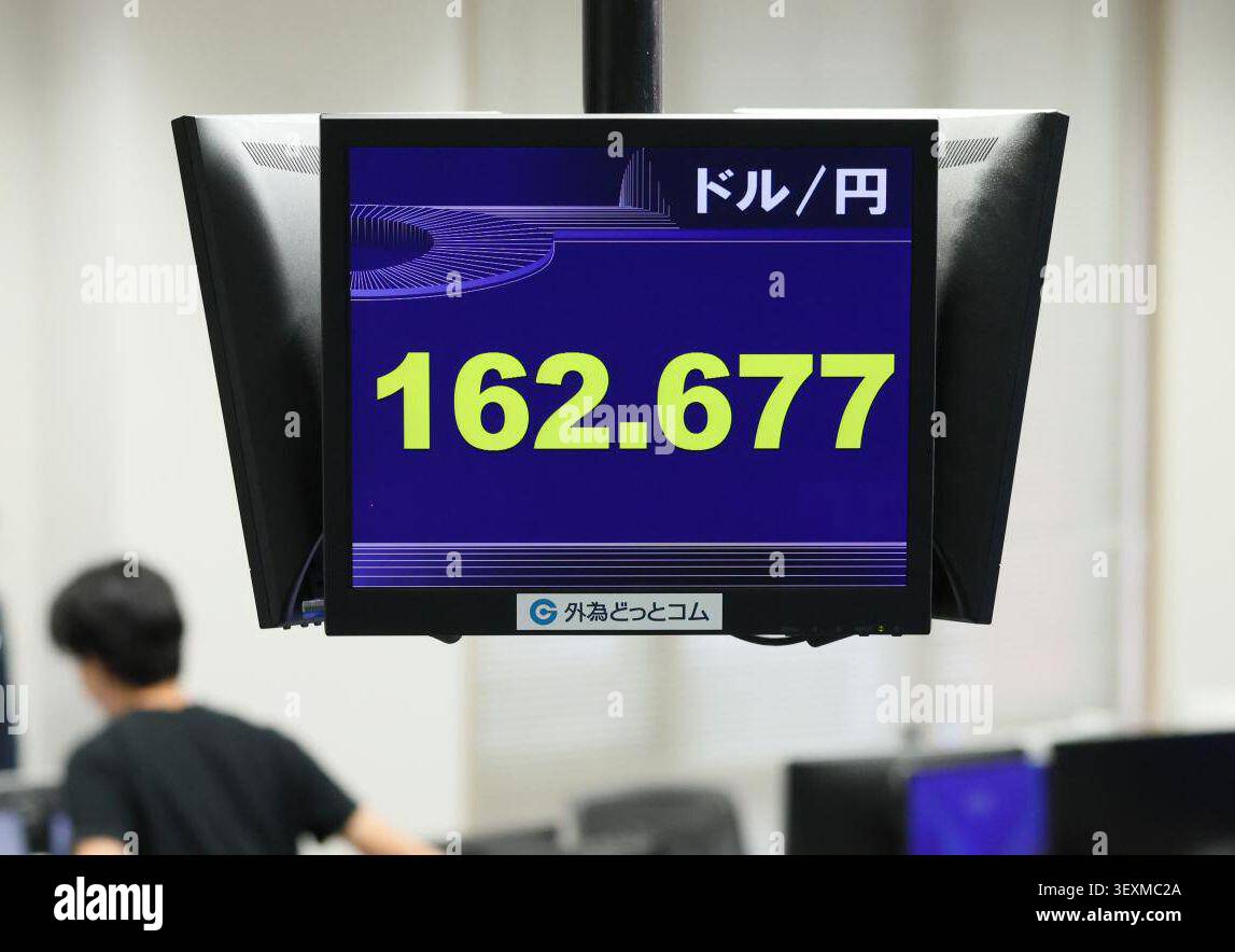 An electronic board displays the current exchange rate of the Japanese ...