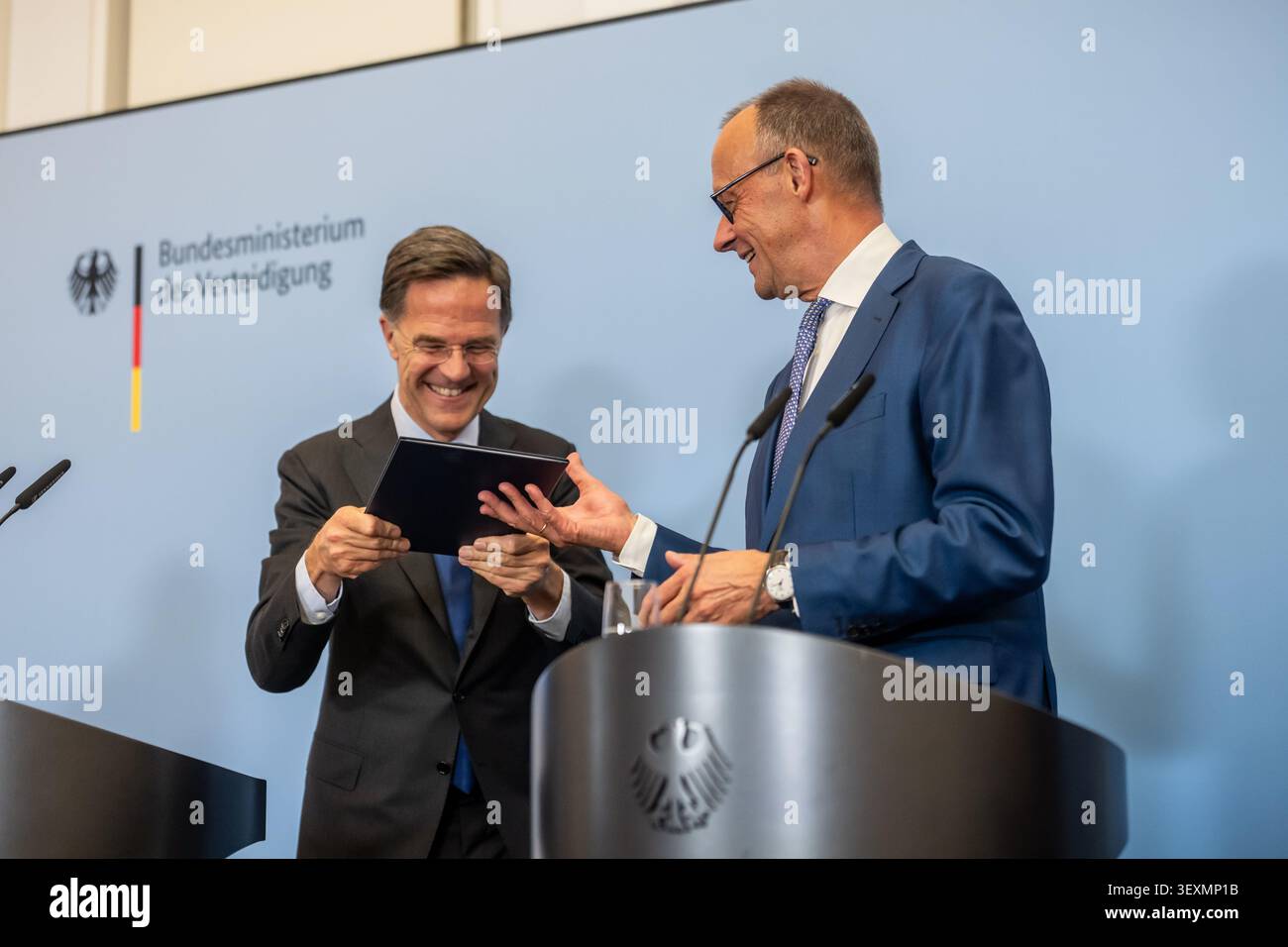 01 July 2026, Berlin: NATO Secretary General Mark Rutte (left) joins ...