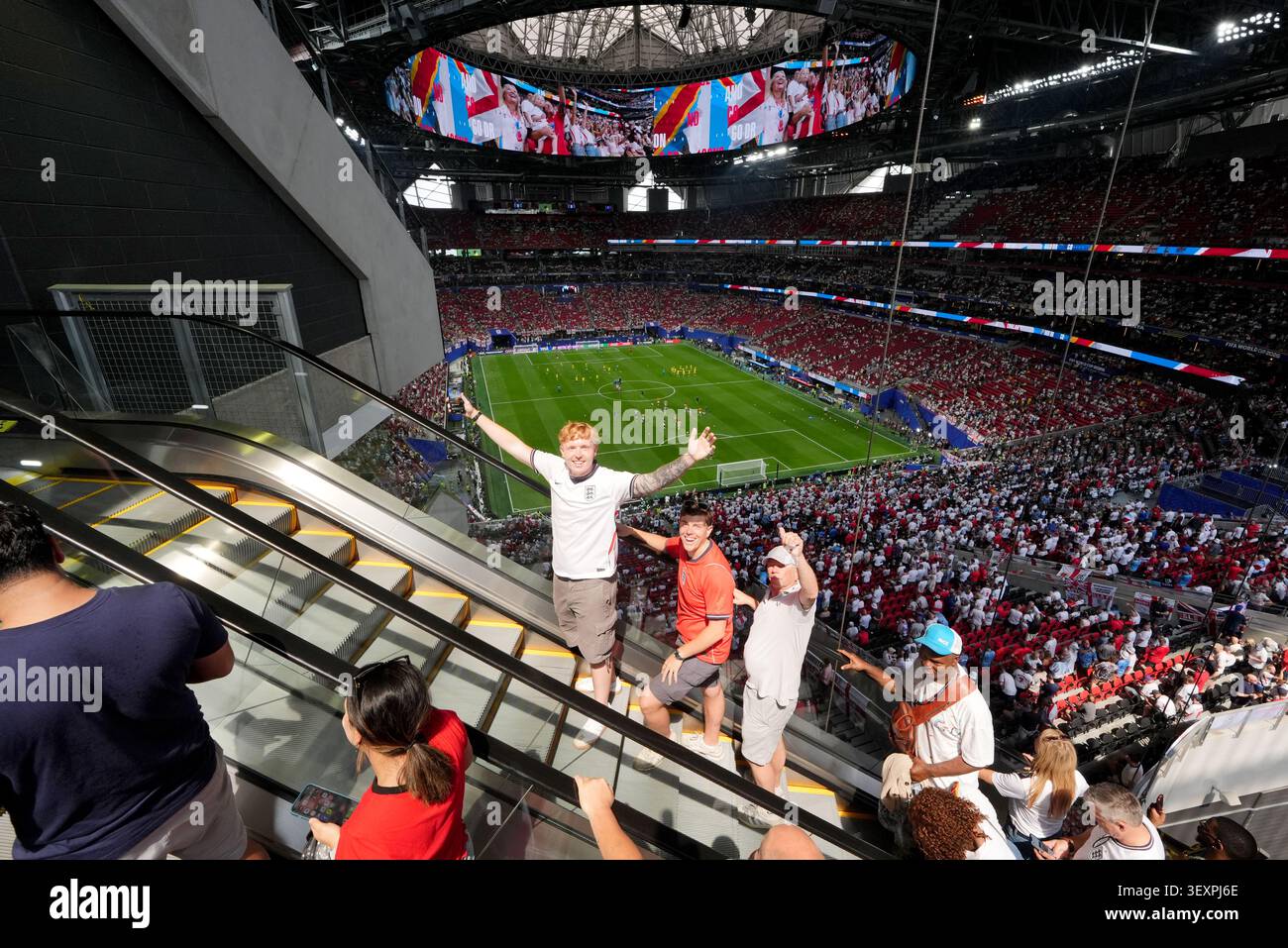 England fans ride on an escalator between levels inside the ground ...