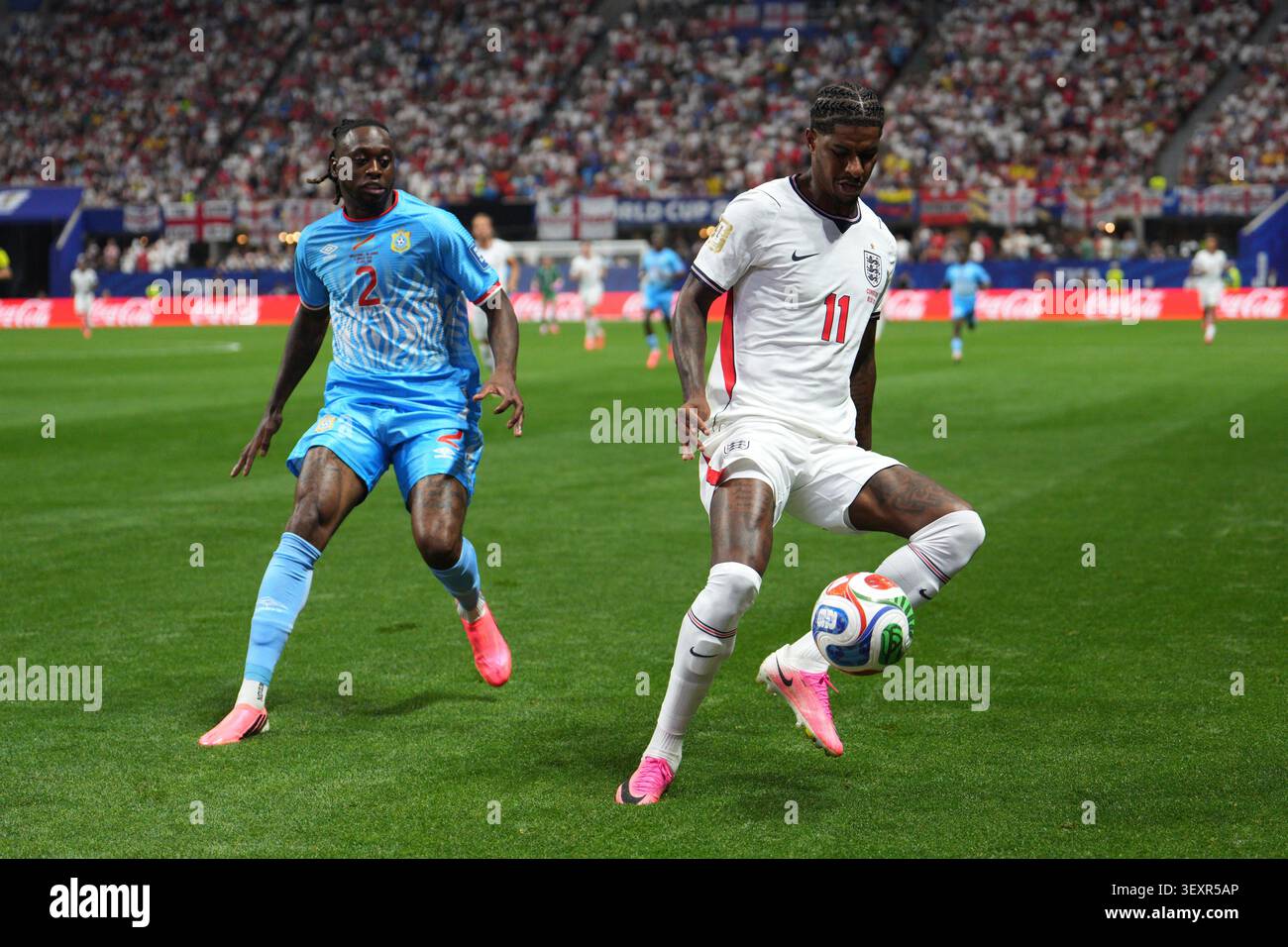 England's Marcus Rashford (11) controls the ball as Congo's Aaron Wan ...