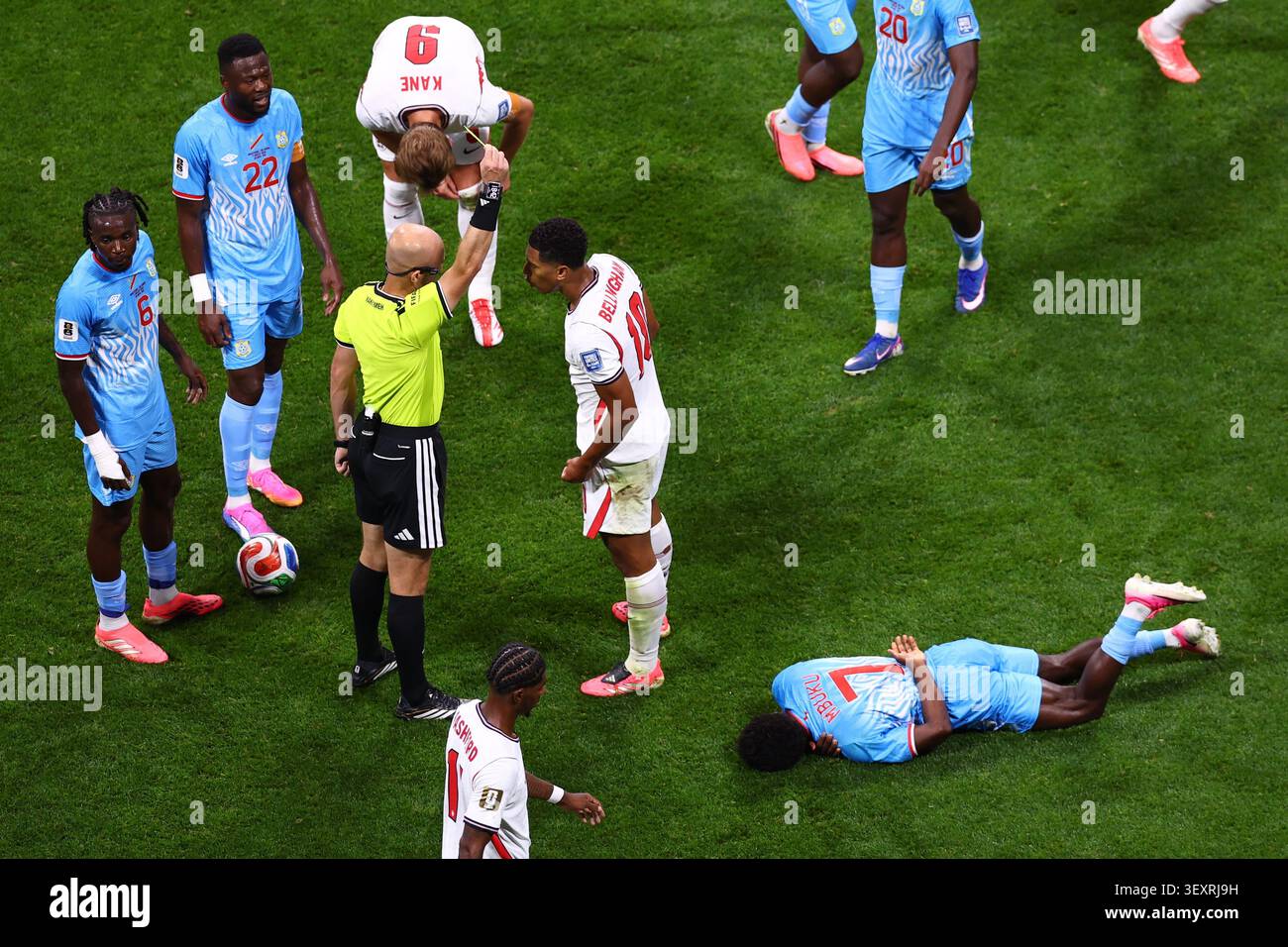 Referee Adham Makhadmeh, of Jordan, shows a yellow card to England's ...